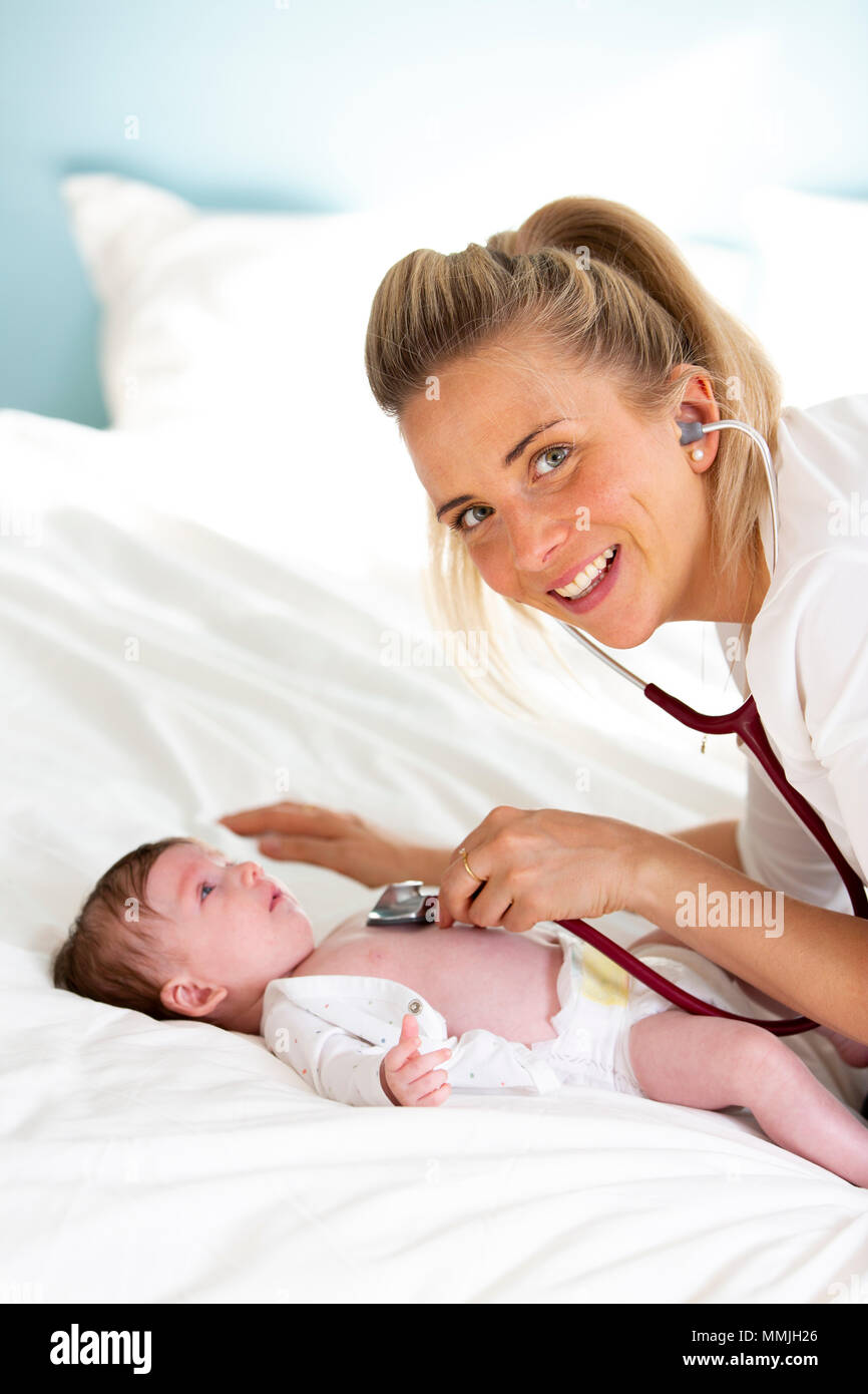 Nurse child home visit mother hi-res stock photography and images - Alamy