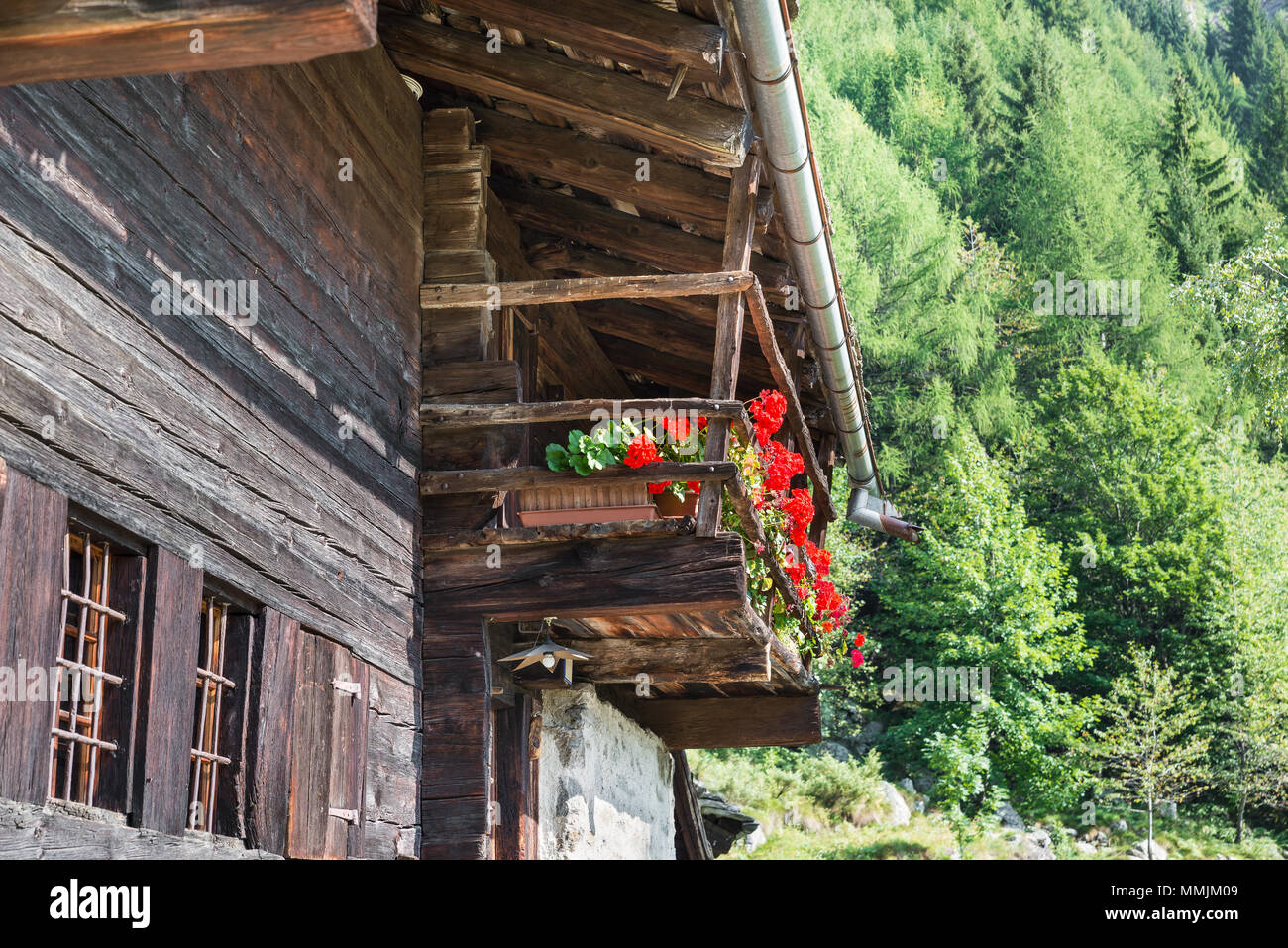 Typical mountain house with flowered balcony, European Alps Stock Photo ...