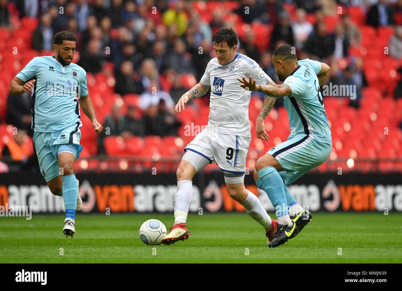 Tranmere Rovers' Andy Cook (centre) in action with Boreham Wood's David ...