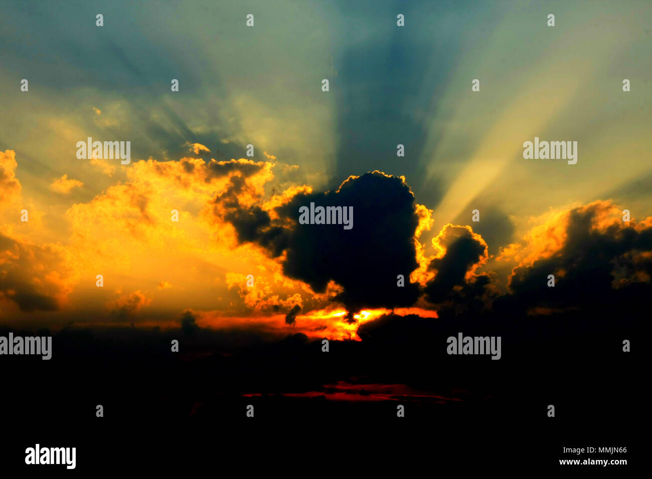 Beautiful sunset with sunbeam, sunray through the clouds. Magneficient ...