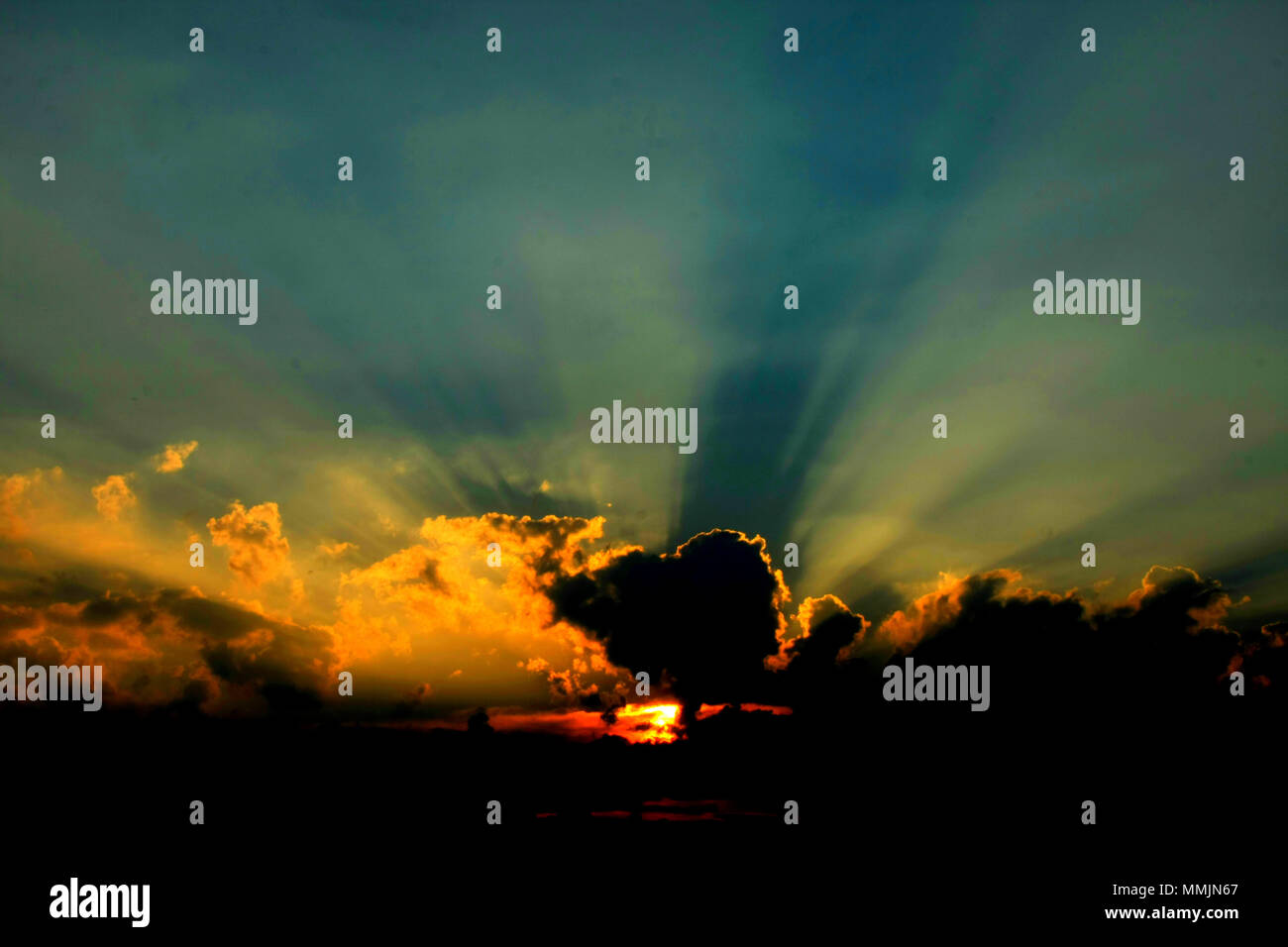 Beautiful sunset with sunbeam, sunray through the clouds. Magneficient ...