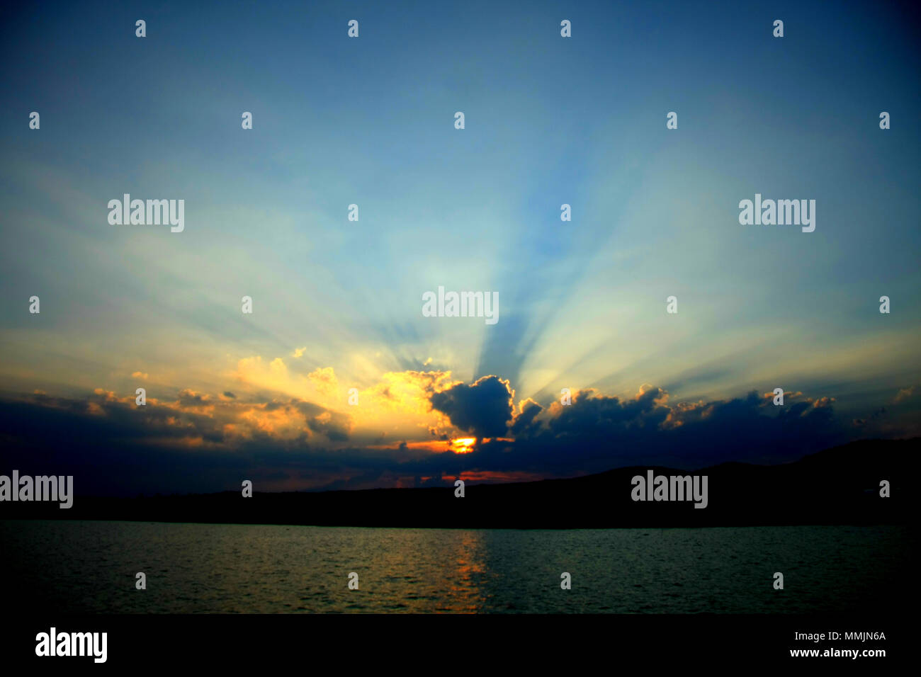 Beautiful sunset with sunbeam, sunray through the clouds. Magneficient ...