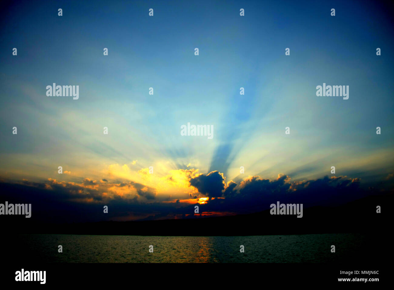 Beautiful sunset with sunbeam, sunray through the clouds. Magneficient ...
