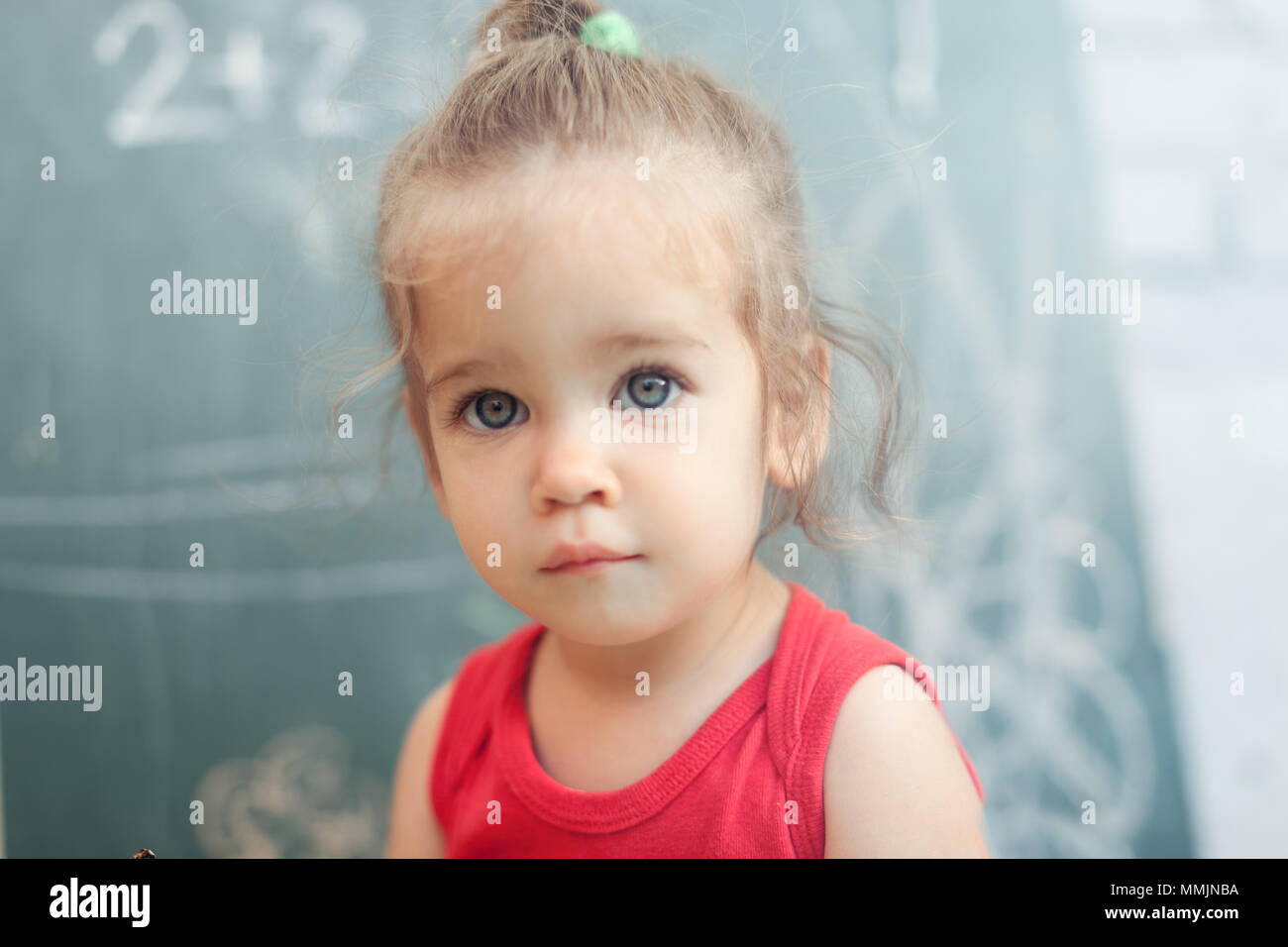 happy school girl on math classes in kindergarten finding solution and ...