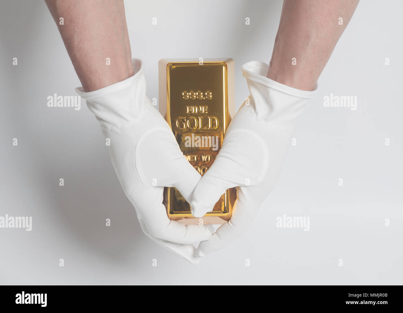 Businessman holding gold bar hi-res stock photography and images - Alamy