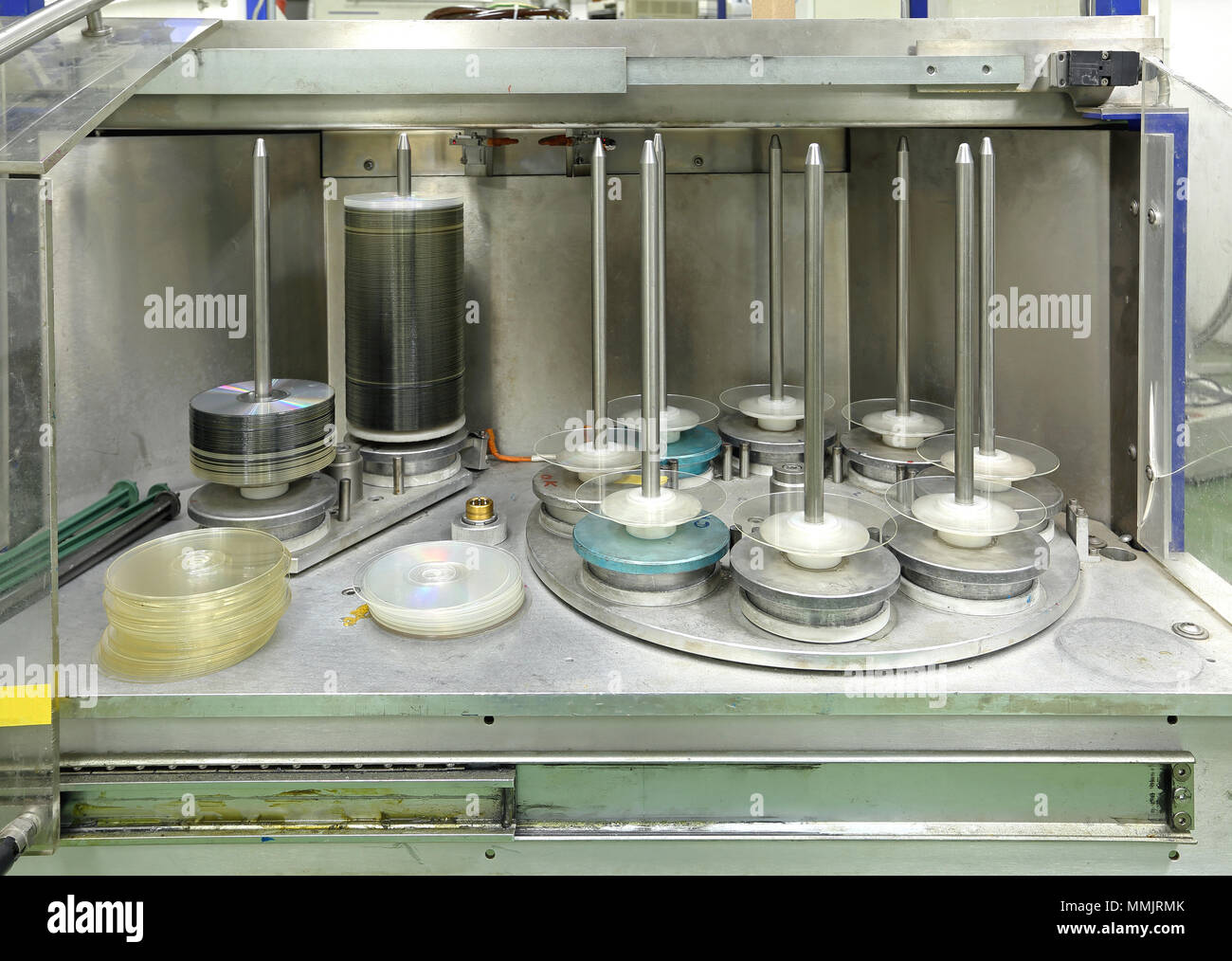 DVD and CD at Rotating Spindles in Production Machine Stock Photo - Alamy