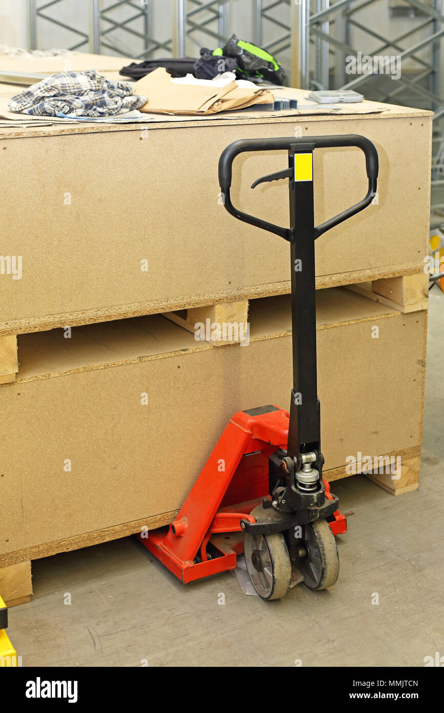 Pallet Jack With Big Wooden Crates Boxes Stock Photo - Alamy
