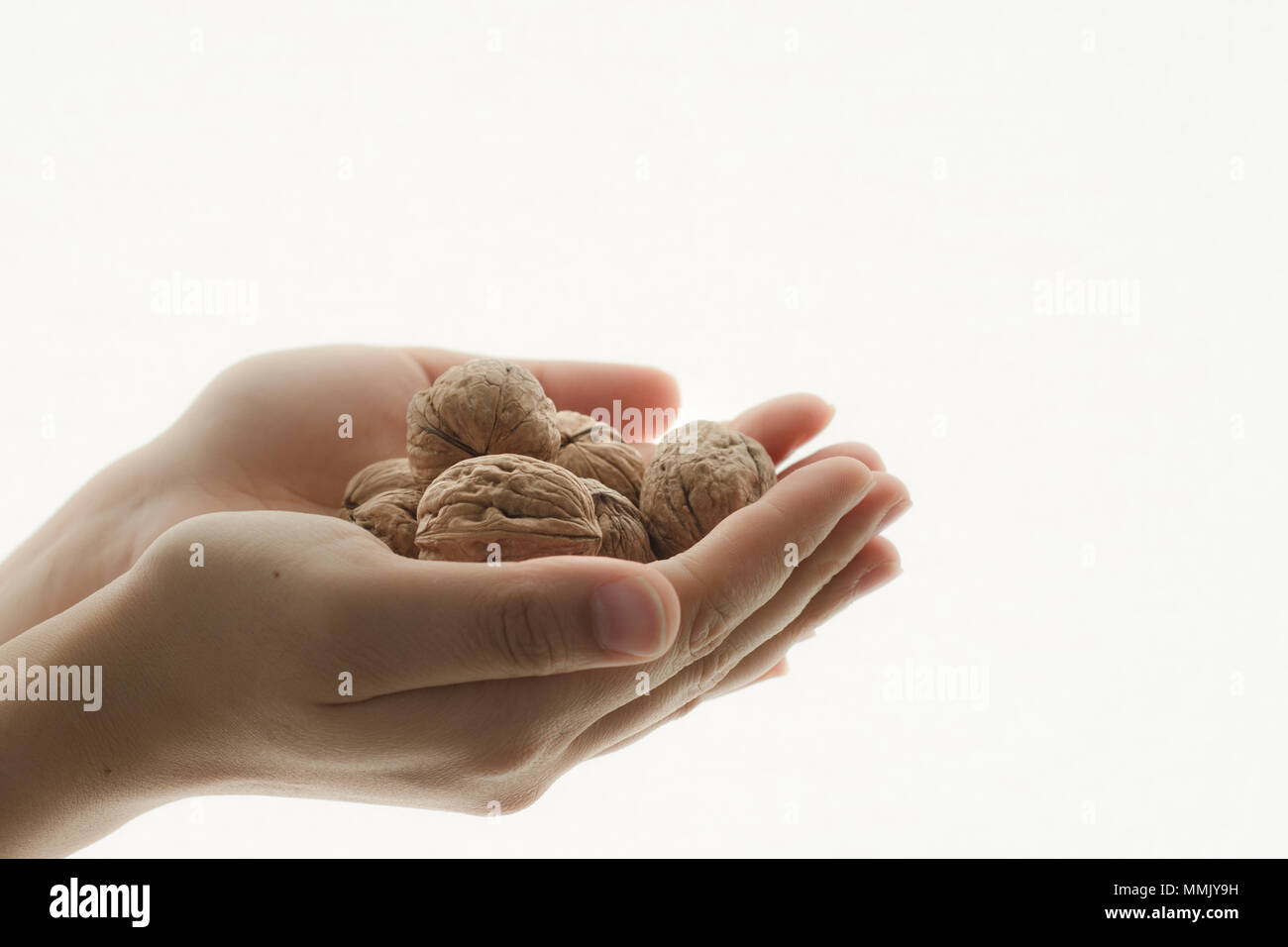Handful of walnuts hi-res stock photography and images - Alamy
