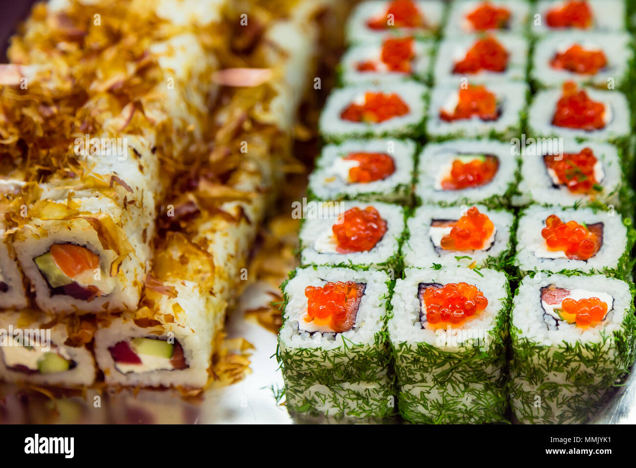 Rolls in the window in the sushi bar. Traditional Japanese food to ...