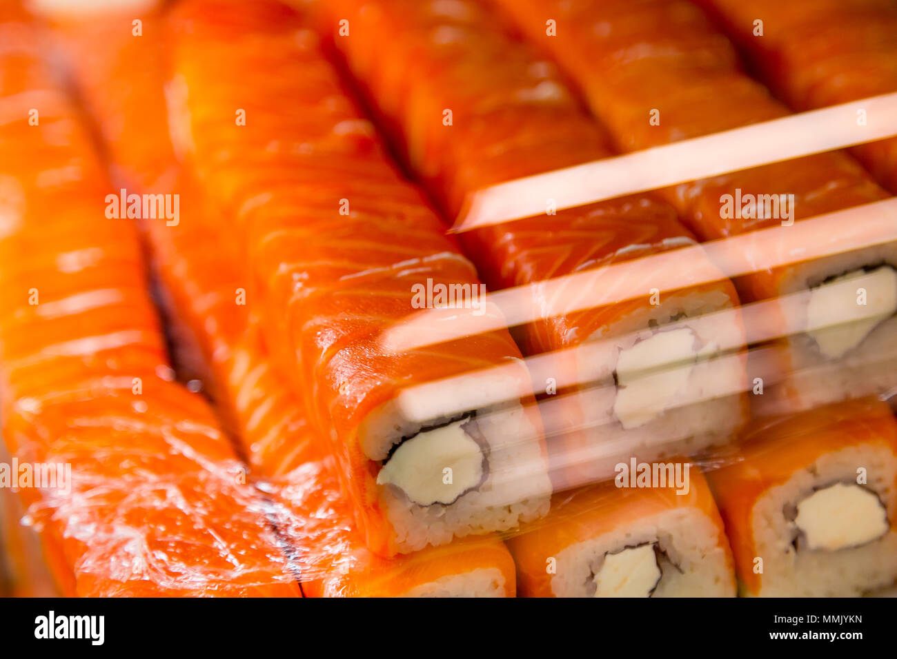 Rolls in the window in the sushi bar. Traditional Japanese food to ...