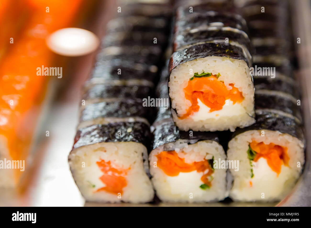 Rolls in the window in the sushi bar. Traditional Japanese food to ...