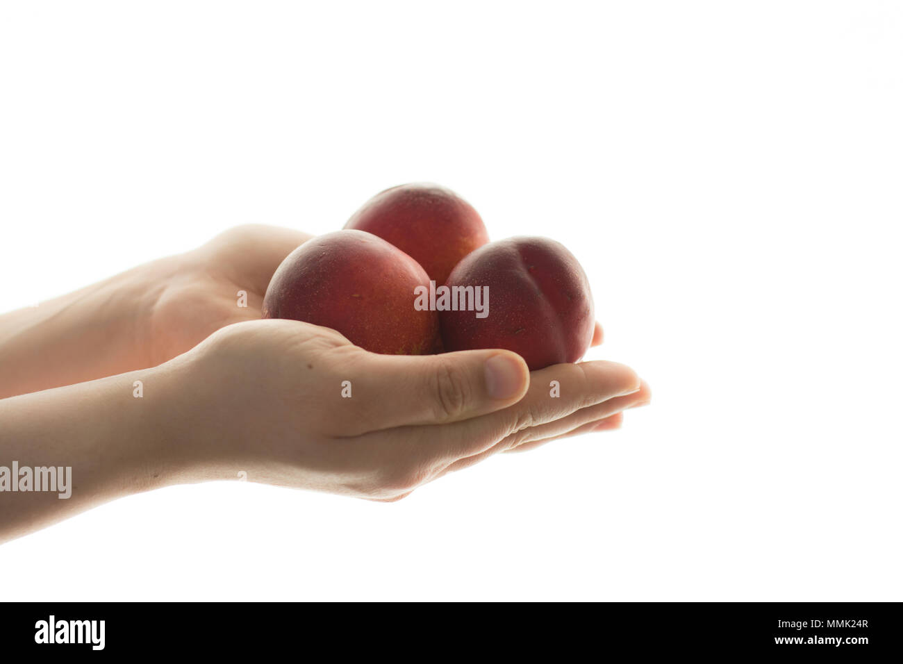 Peach in hand hi-res stock photography and images - Alamy