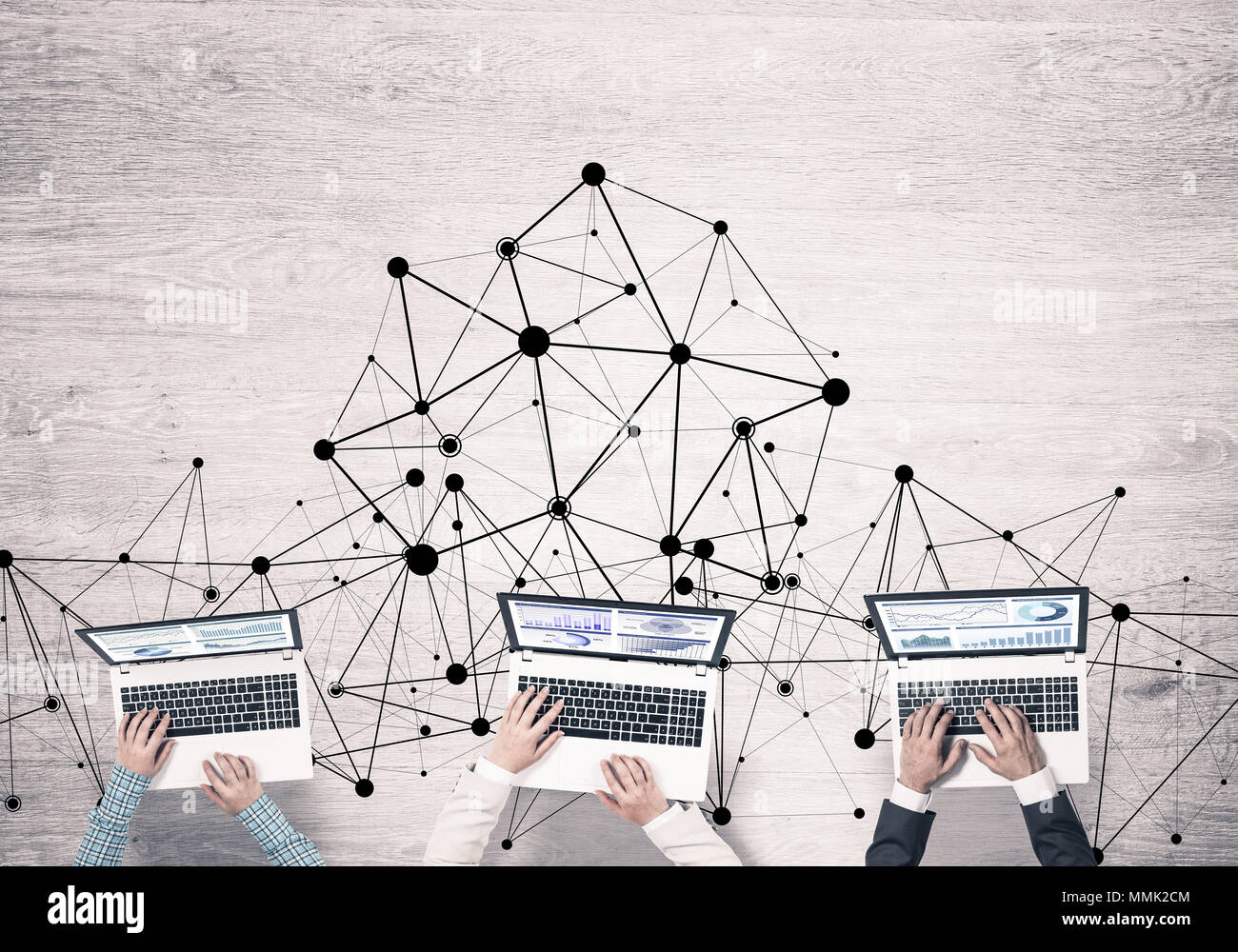 Group of three people with devices in hands working together as symbol ...