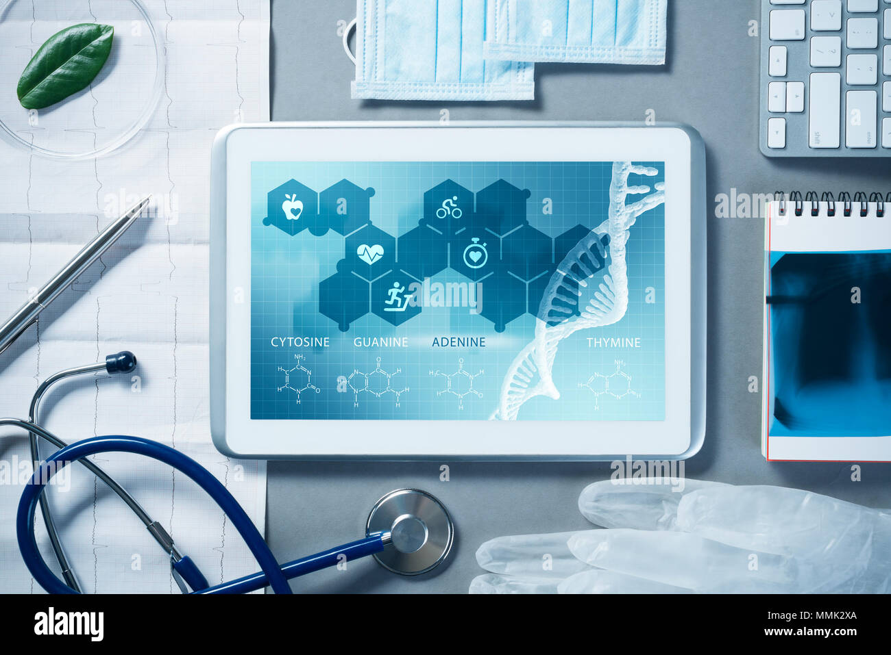 White tablet pc and doctor tools on gray surface Stock Photo - Alamy