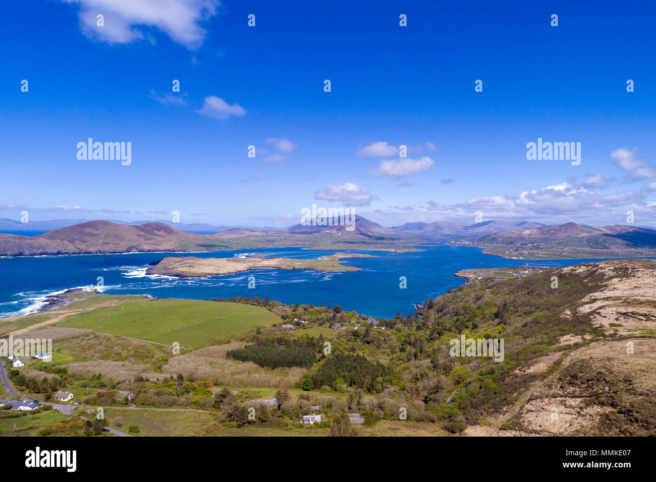 Valentia Island, County Kerry Ireland with bright blue sky and fluffy ...