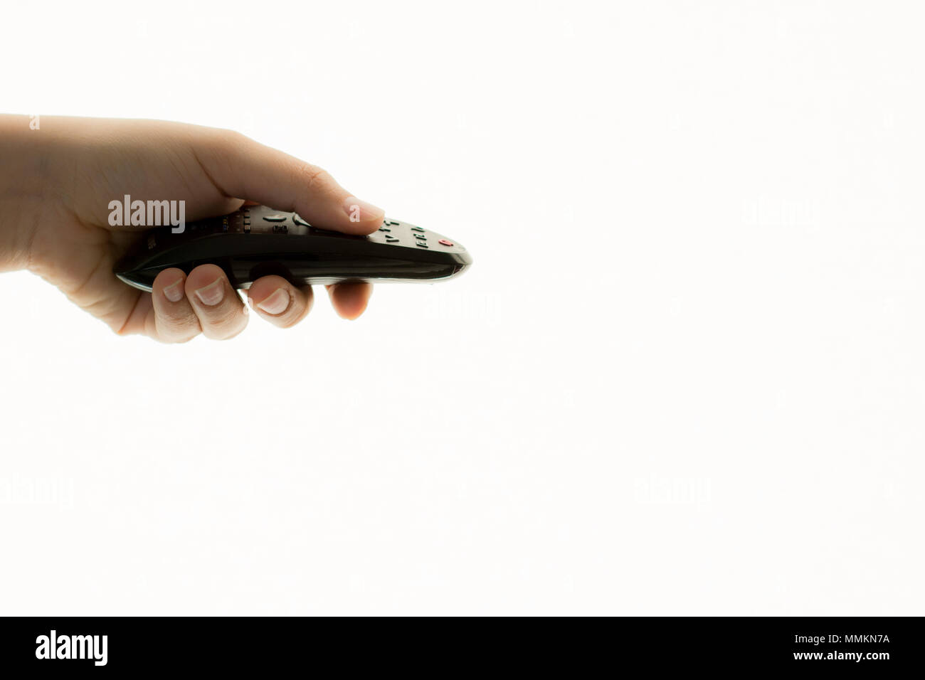 Using TV Remote Control Stock Photo - Alamy