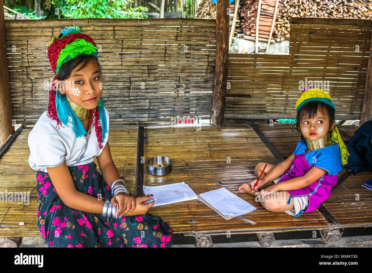 Chiang Rai, Thailand - July 25, 2011: A Karen Padaung tribe woman and ...