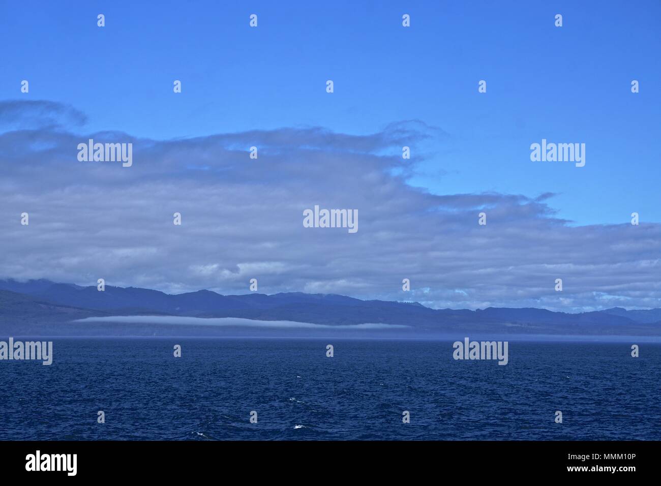 Morning at sea: Clouds and fog over Alaskan islands in the North ...