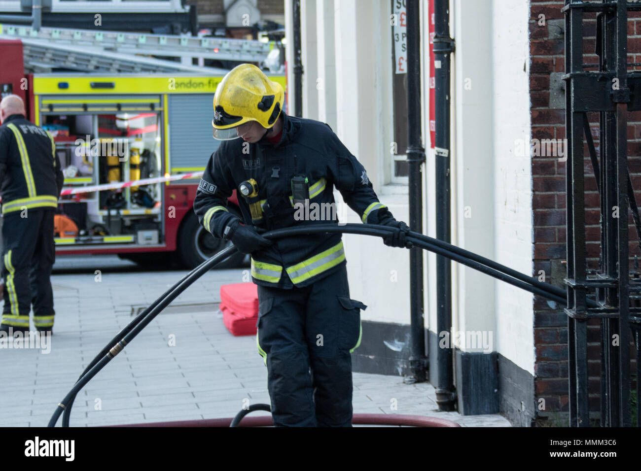 Team london brigade firefighters hi-res stock photography and images ...