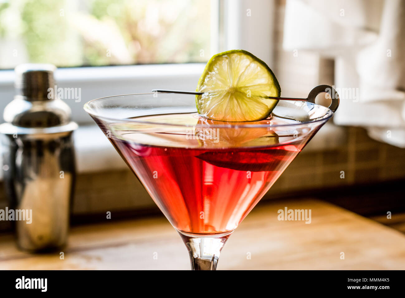 Cosmopolitan Cocktail with shaker on wooden surface. Beverage Concept ...