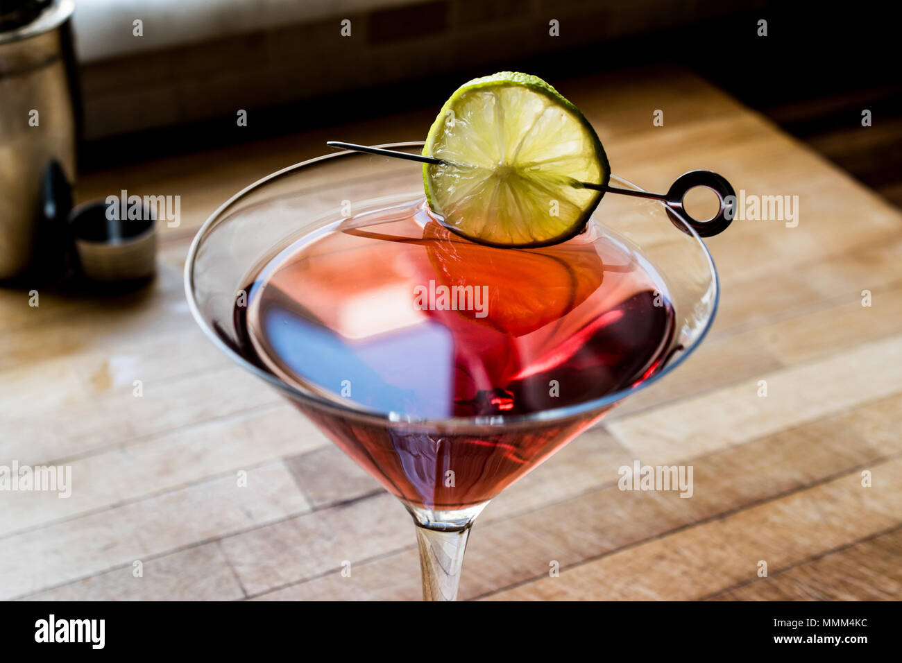 Cosmopolitan Cocktail with shaker on wooden surface. Beverage Concept ...