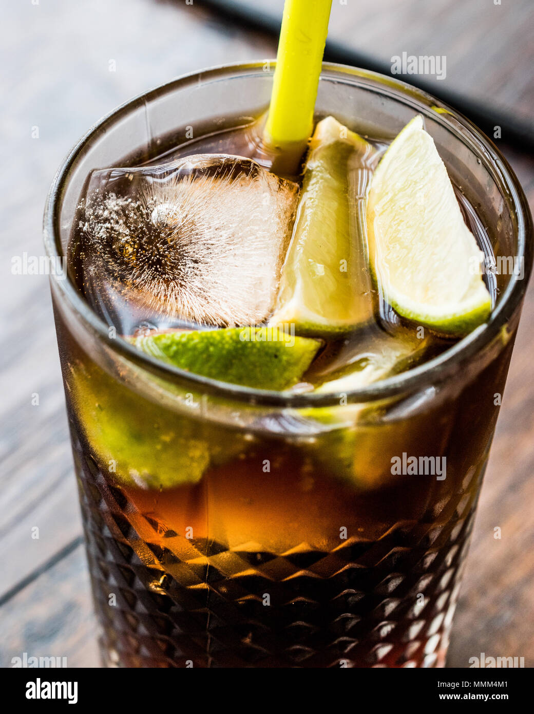 Cuba Libre Cocktail with lime and ice. Beverage concept Stock Photo - Alamy
