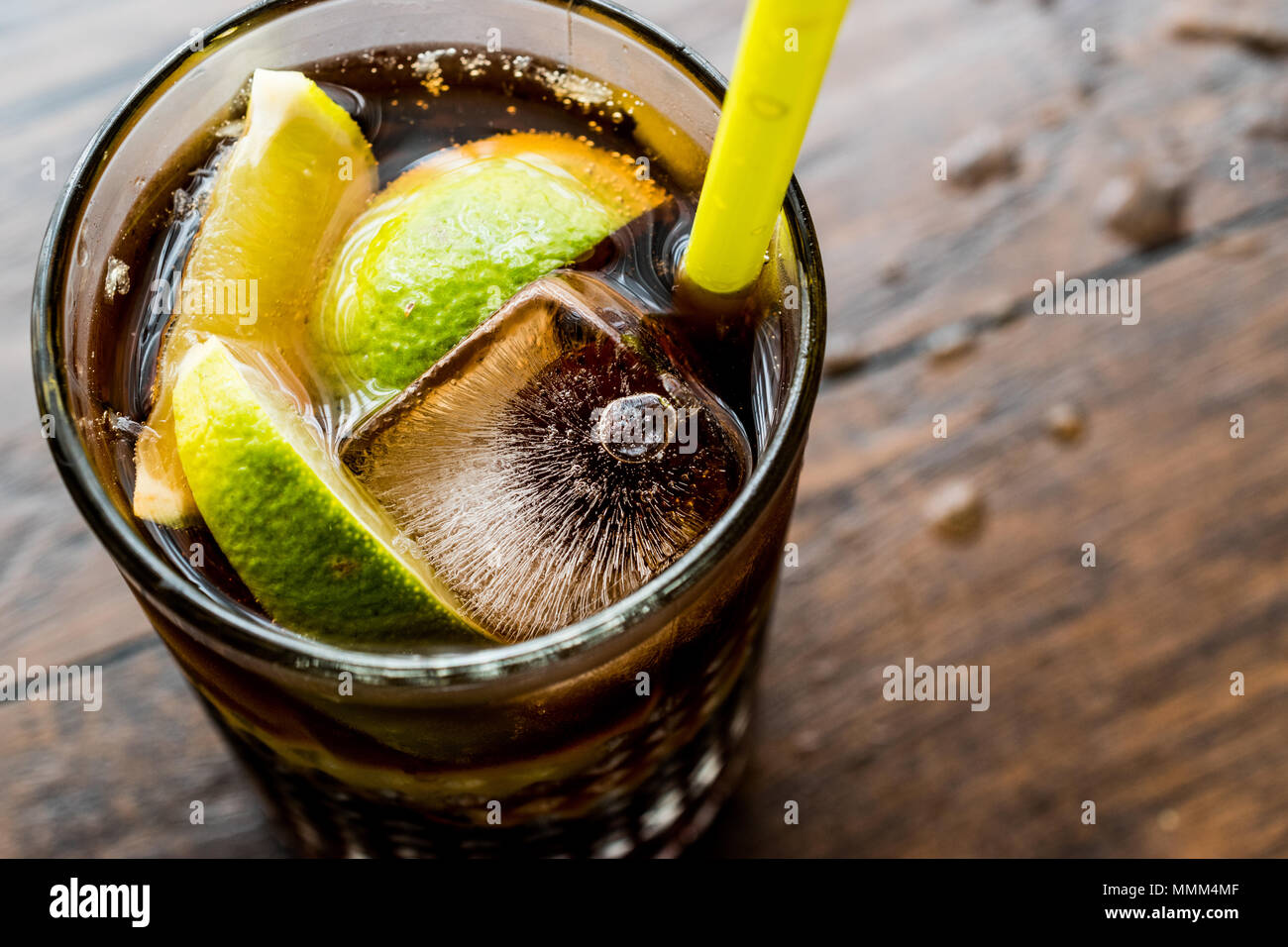 Cuba Libre Cocktail with lime and ice. Beverage concept Stock Photo - Alamy