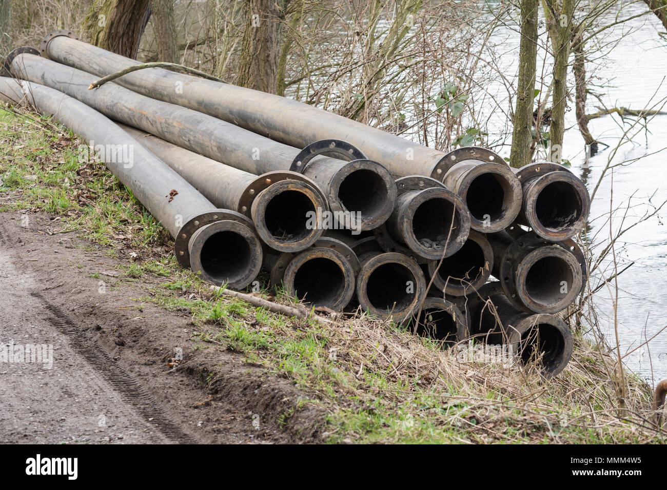 Pipeline, plastic pipes float on the water surface Stock Photo - Alamy