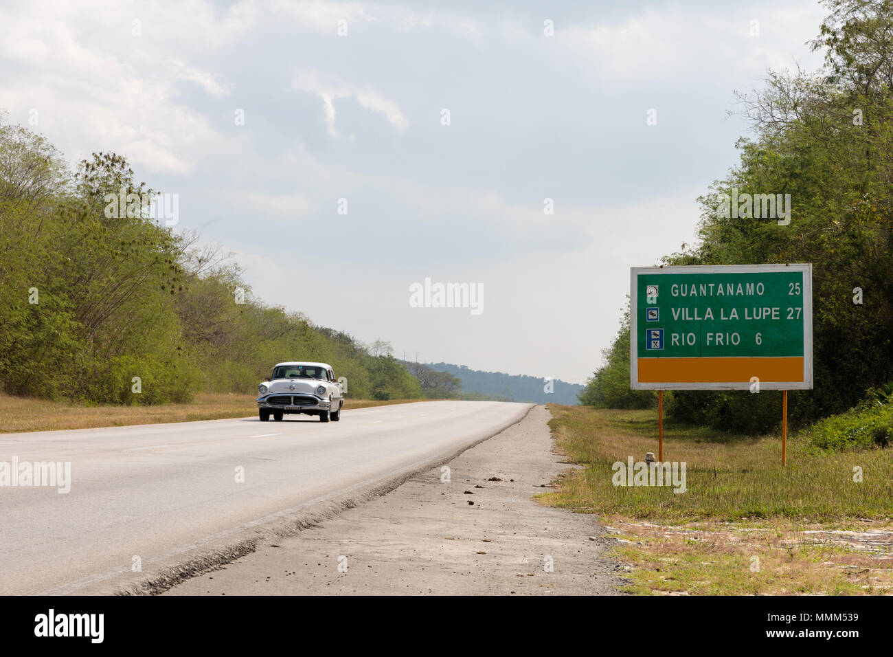 Sign on the Street and Landscape at Border to the Guantanamo province ...
