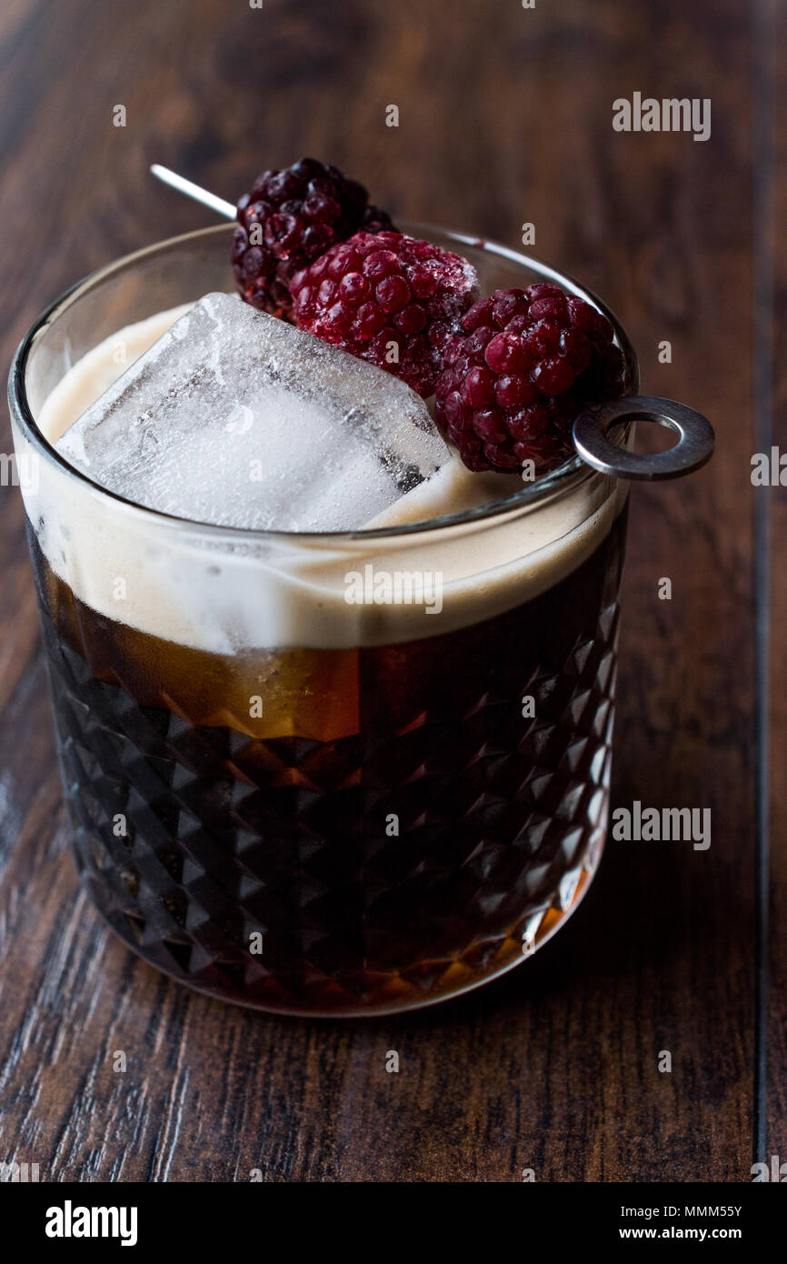 Black / Dark Beer Cocktail with Blackberries and Ice on Wooden Surface ...