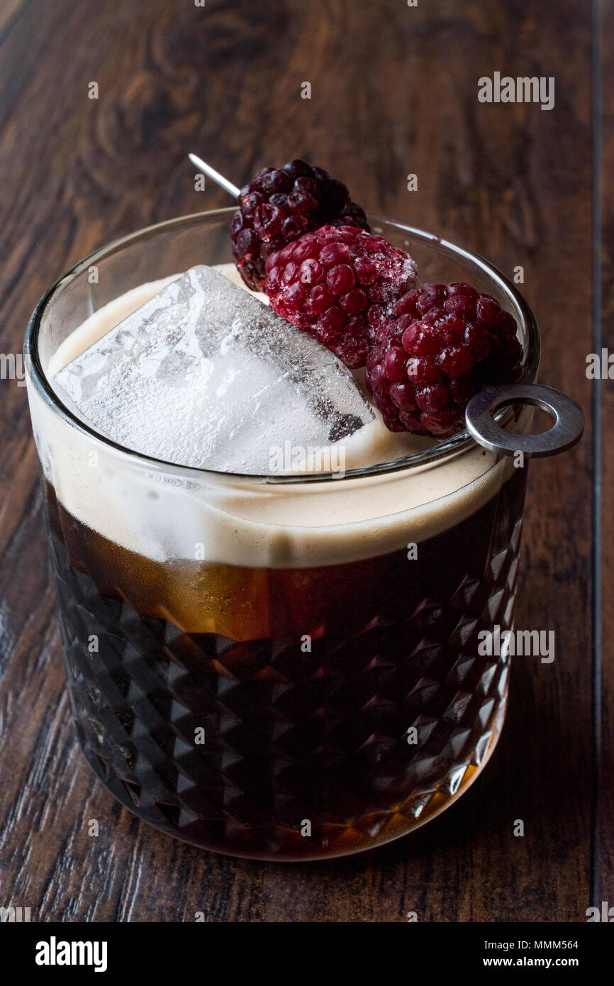 Black / Dark Beer Cocktail with Blackberries and Ice on Wooden Surface ...
