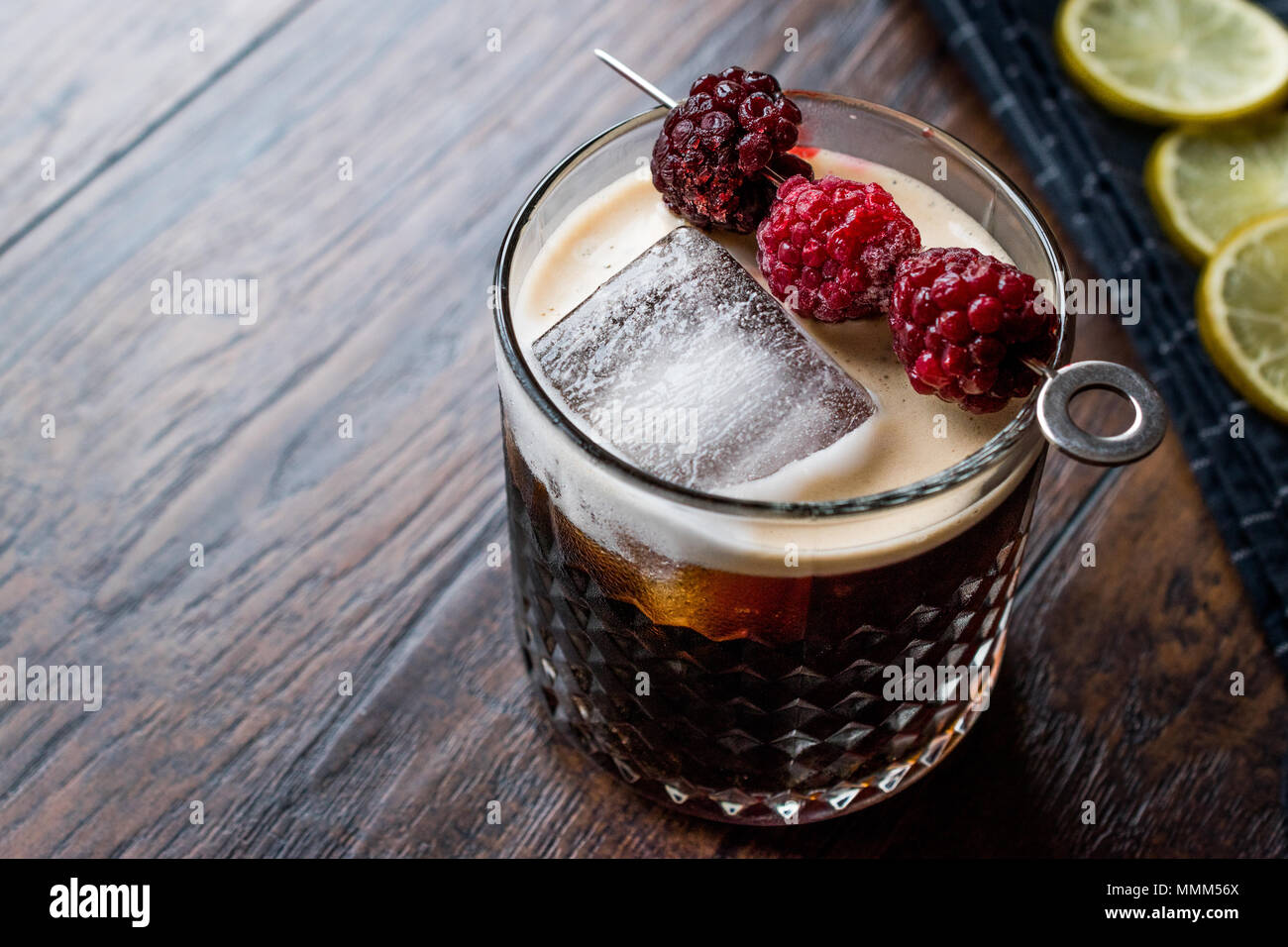 Black / Dark Beer Cocktail with Blackberries and Ice on Wooden Surface ...