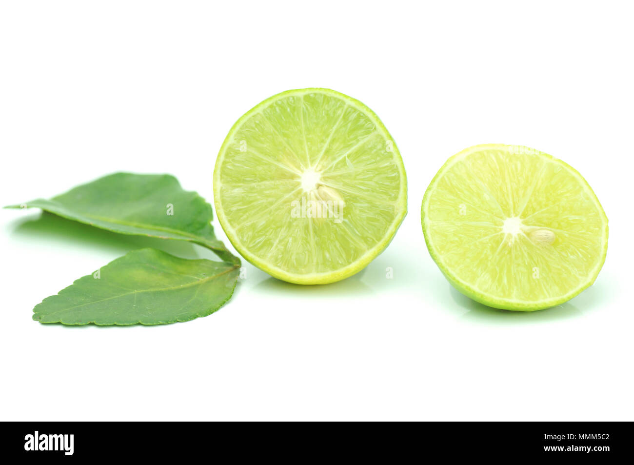 green lemon slice isolated on white background Stock Photo - Alamy