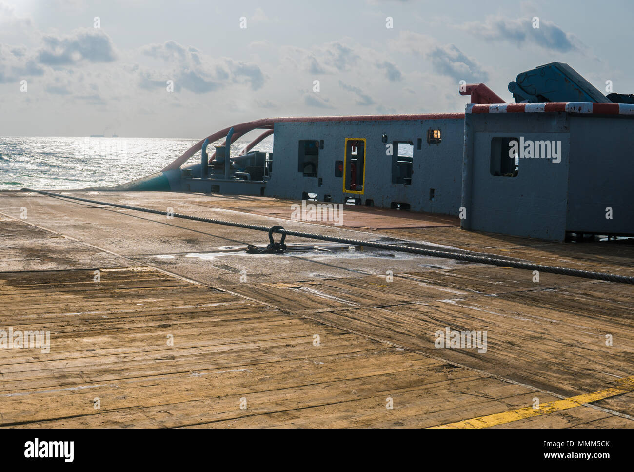 Towing wire on deck of anchor-handling Tug Supply AHTS vessel during ...
