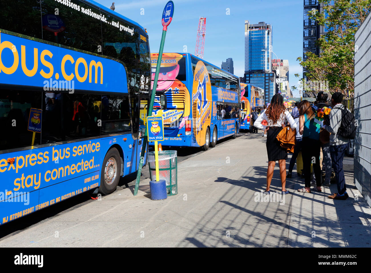 People queuing for buses for travel to other cities Stock Photo - Alamy