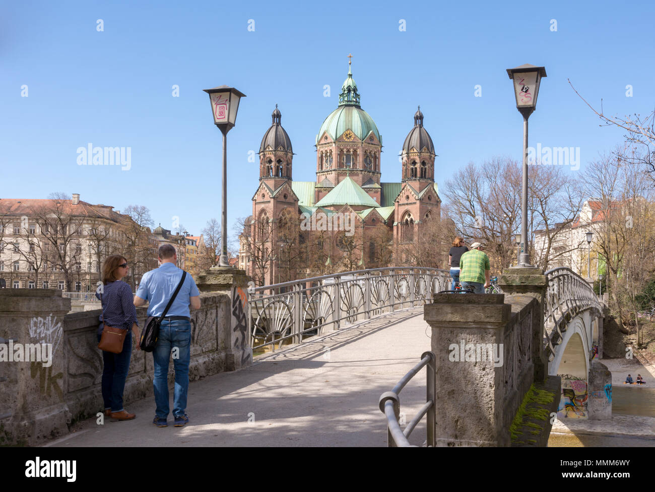 MUNICH, GERMANY - APRIL 4: Tourists at a bridge to the Saknkt Lukas ...