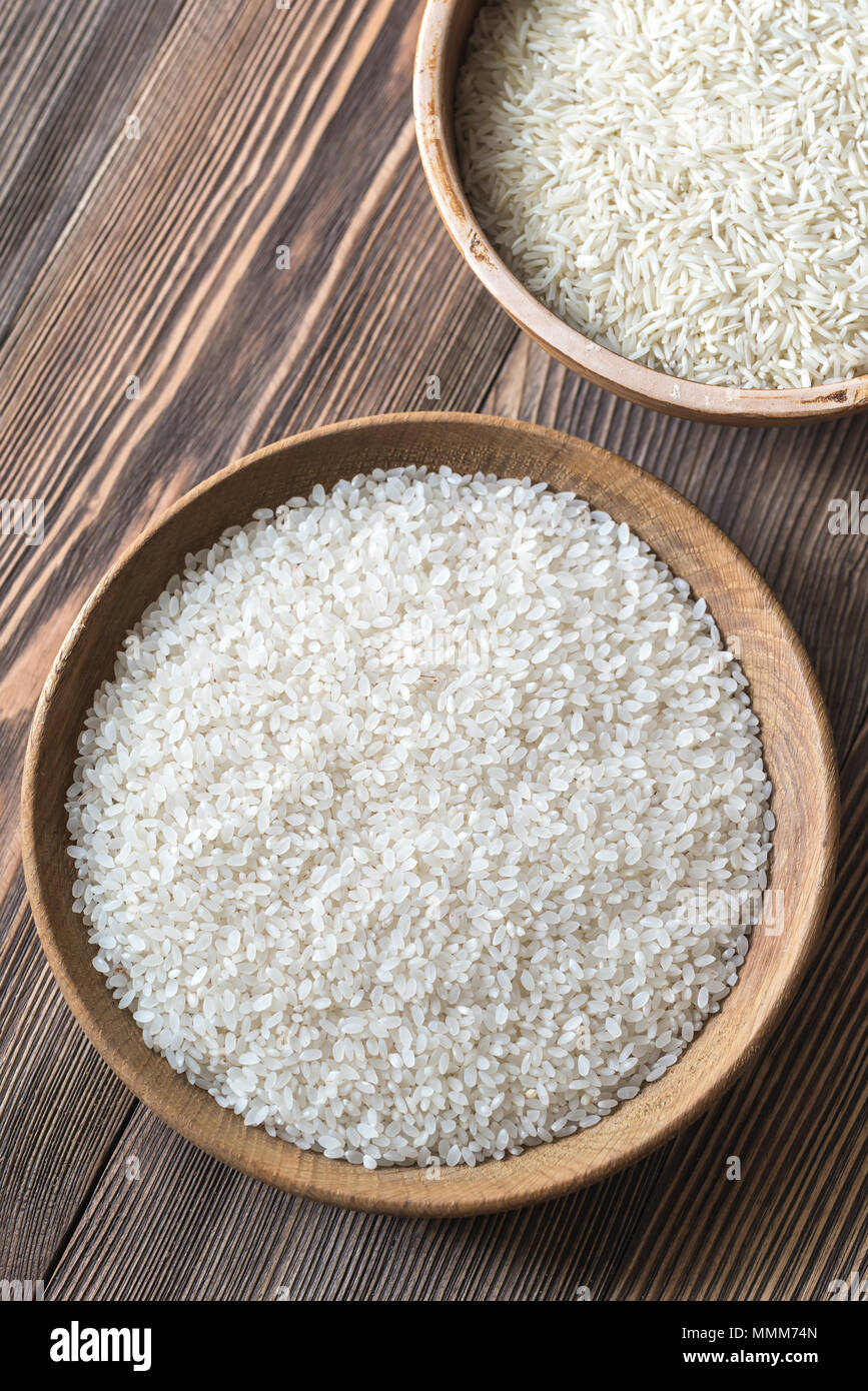 Bowls of uncooked camolino and basmati rice Stock Photo - Alamy
