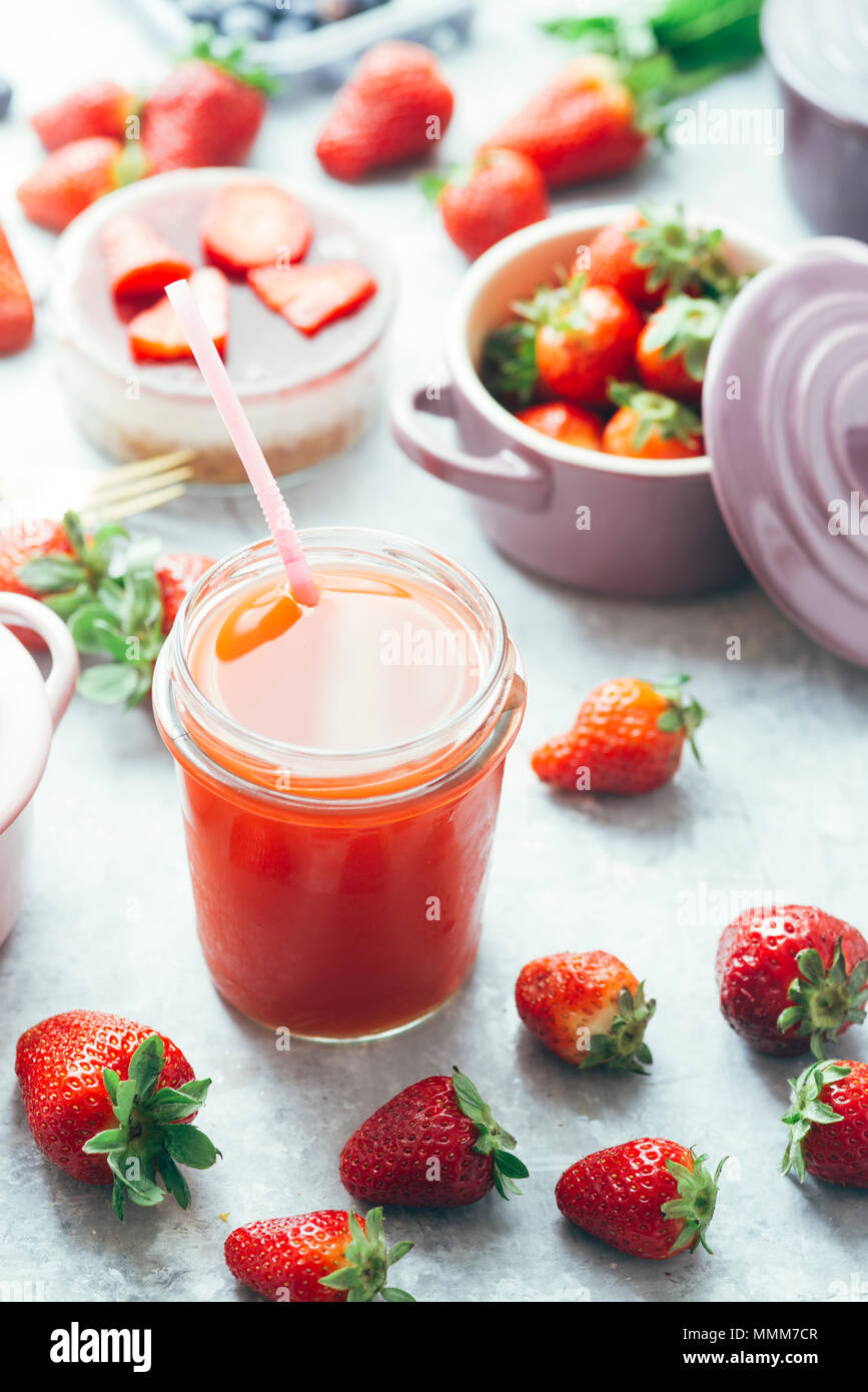 Frontal view of strawberry detox juice in w berries inside ceramic ...