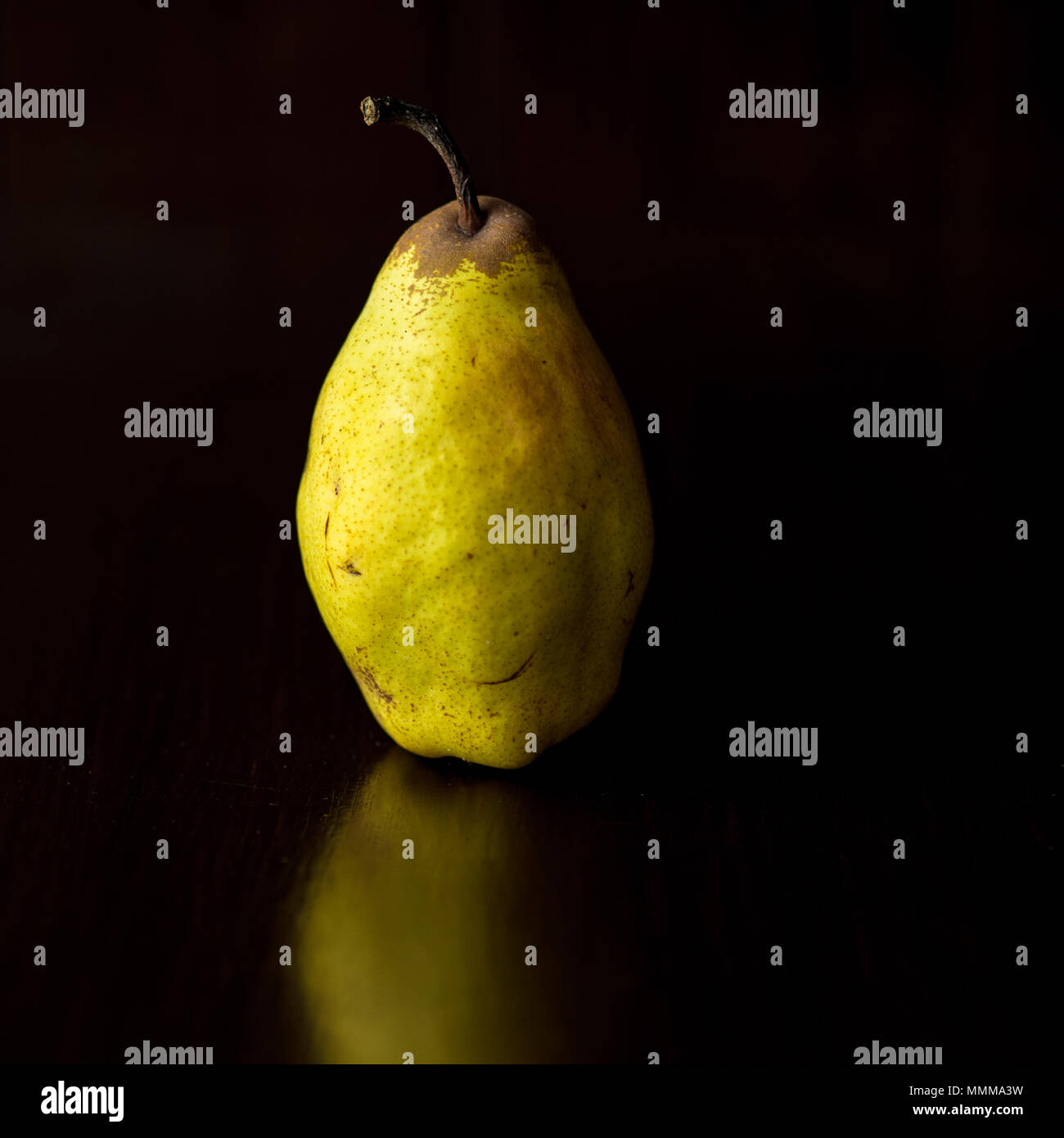 Still life pear on a dark background Stock Photo - Alamy