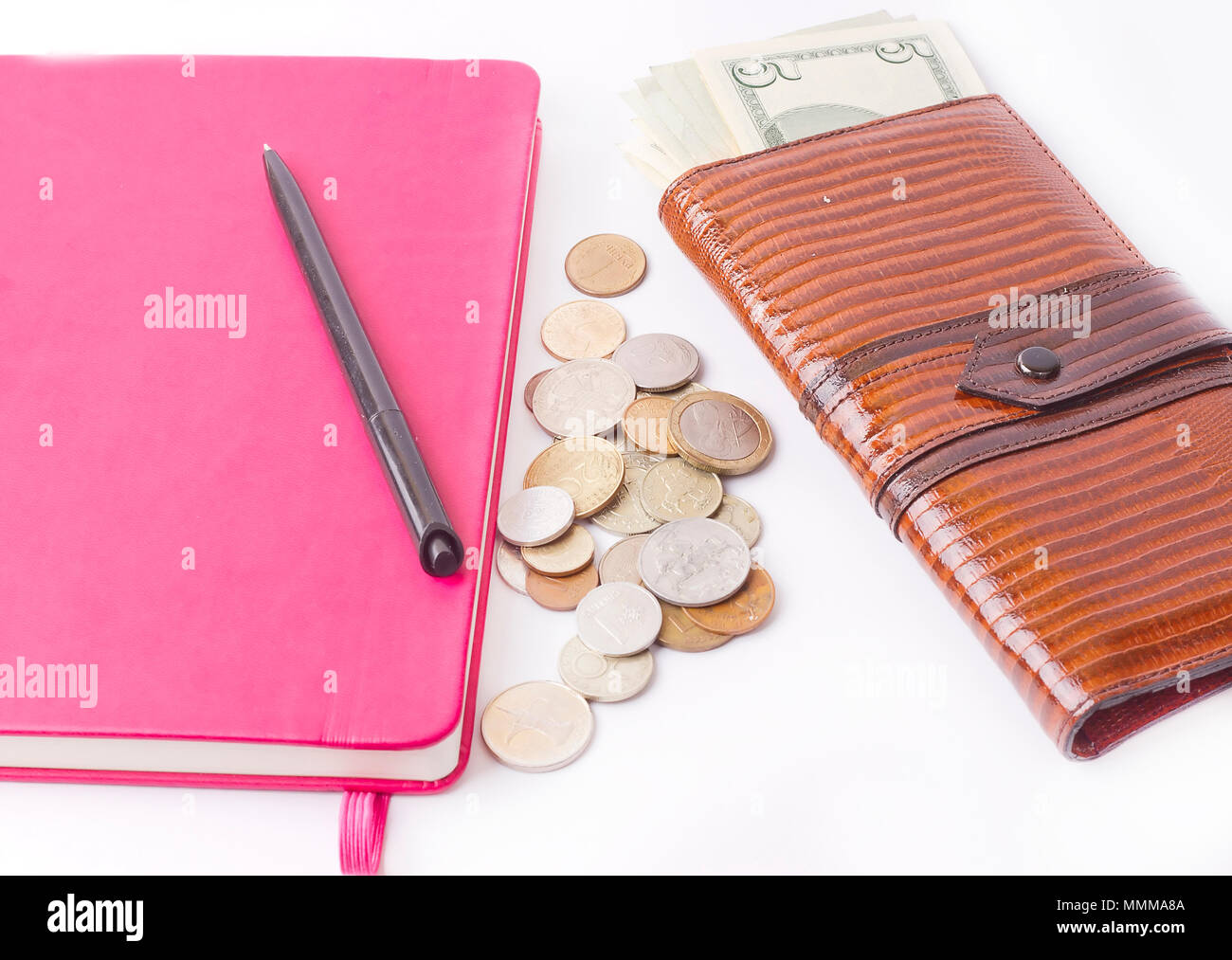 Diary with money and pen isolated on white background Stock Photo - Alamy