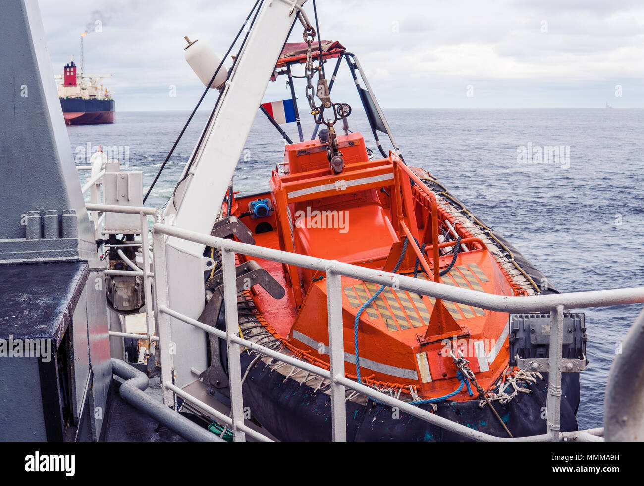 Lifeboat or FRC fast rescue craft boat in the vessel at sea. Tanker ...
