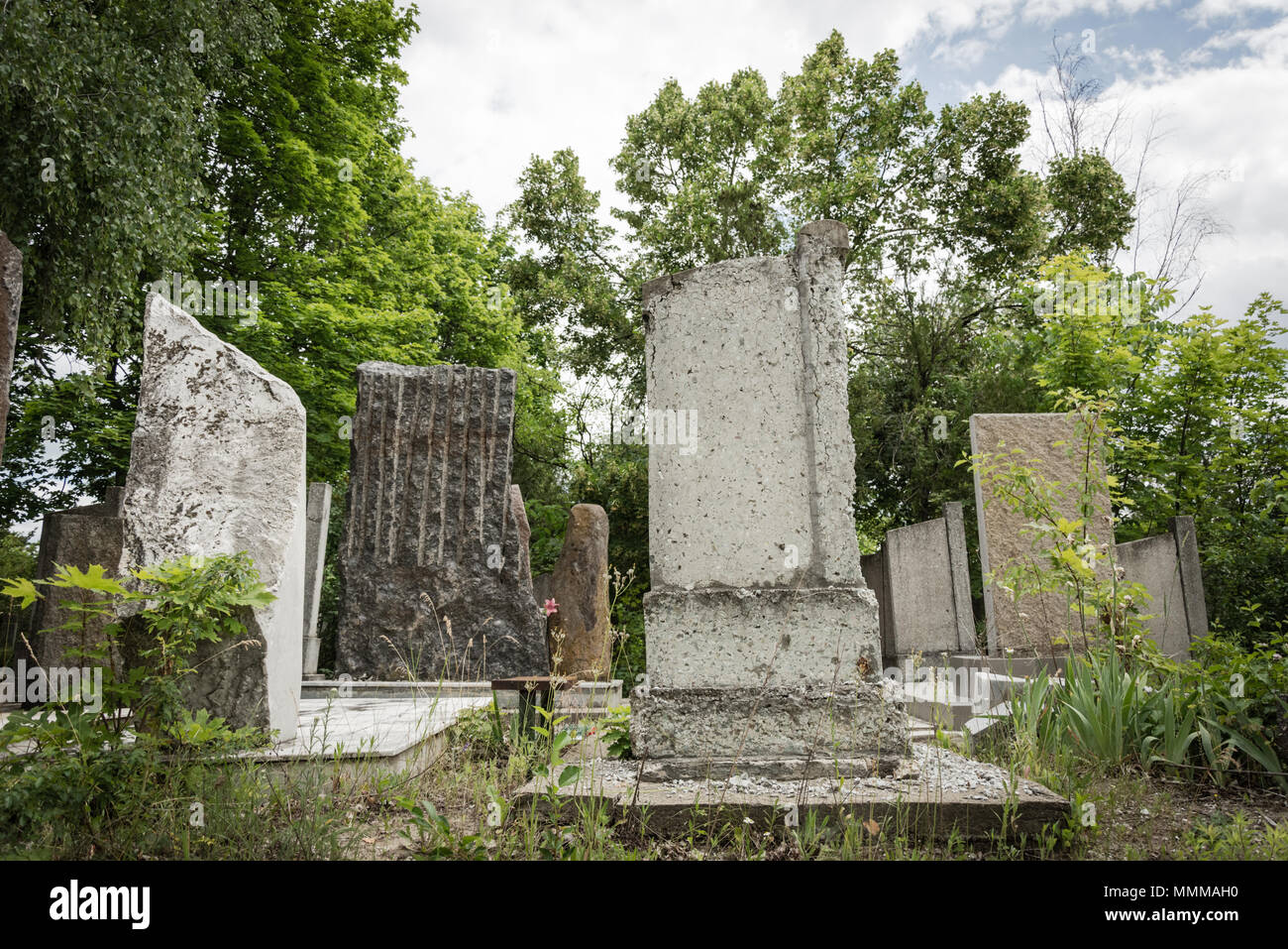 Memorial stone of granite slabs in the Jewish cemetery Stock Photo - Alamy