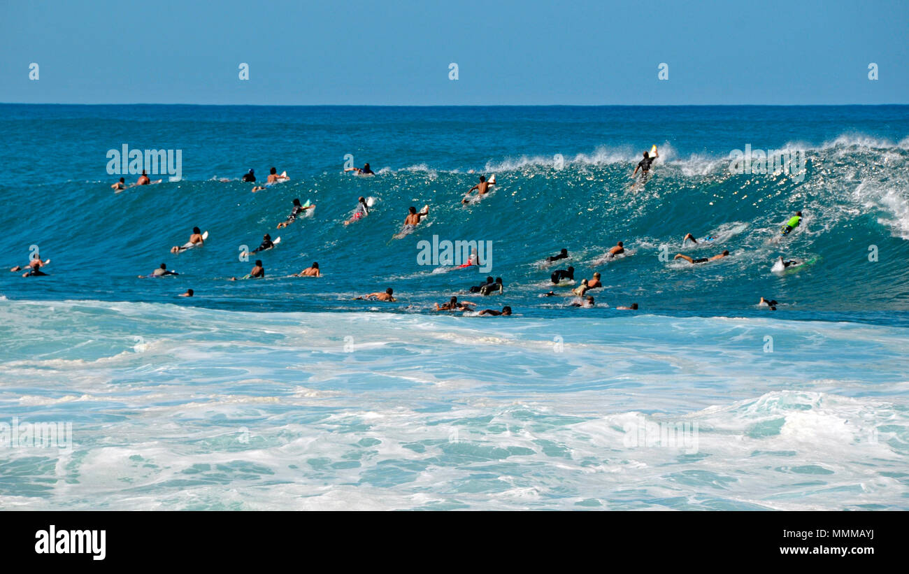 Crowded world-famous surf break of Pipeline, North Shore of Oahu ...