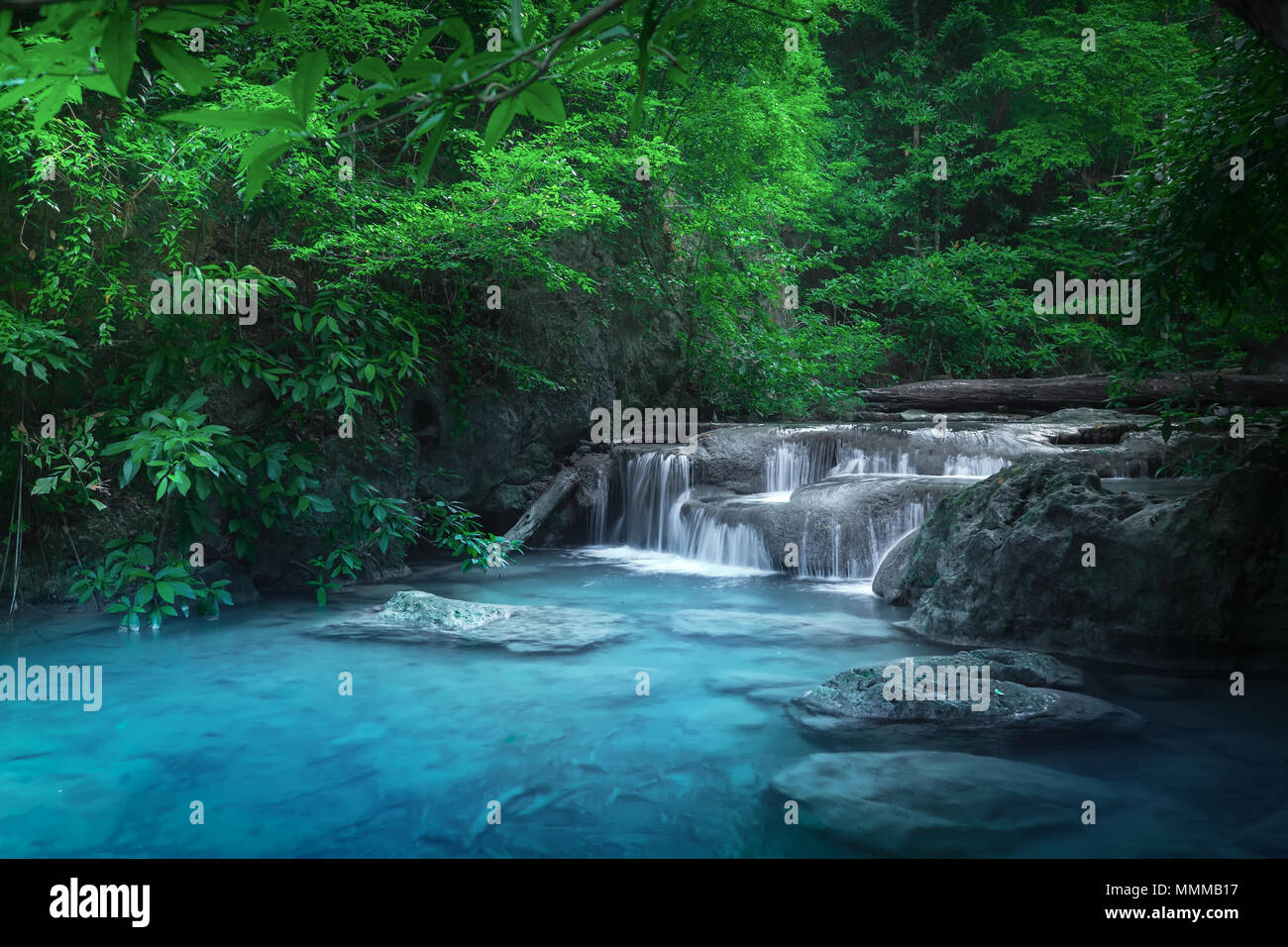 Jangle landscape with flowing turquoise water of Erawan cascade ...