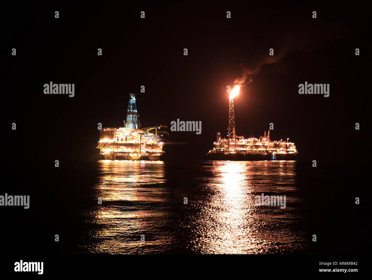 Night view of FPSO tanker vessel near Oil Rig. Offshore oil and gas ...