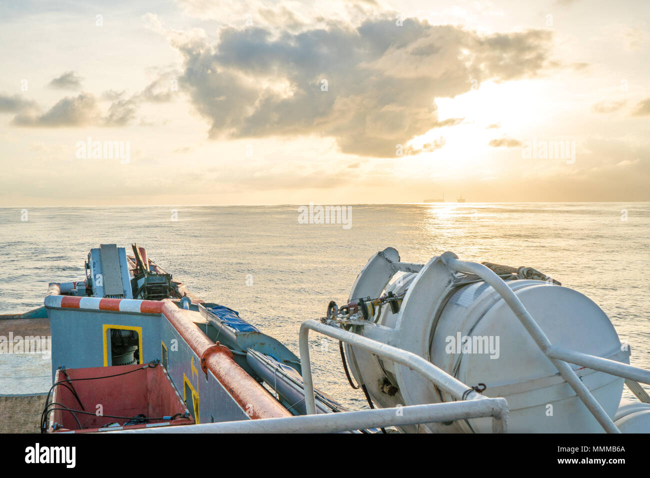 view of ocean tug ship at sea. Freedom of endless ocean diring sunset ...