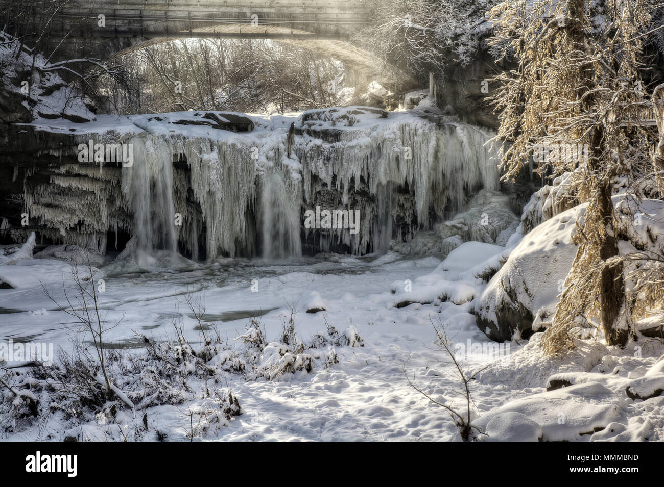 West Elyria Falls Ohio during winter. This cascading waterfall is in ...