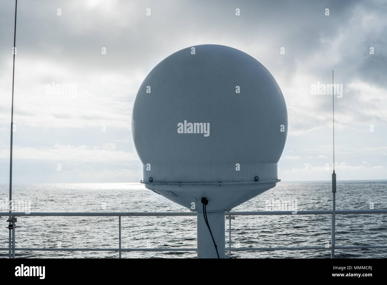 Sattelite communication VSAT antenna on the top monkey deck. Vessel ...