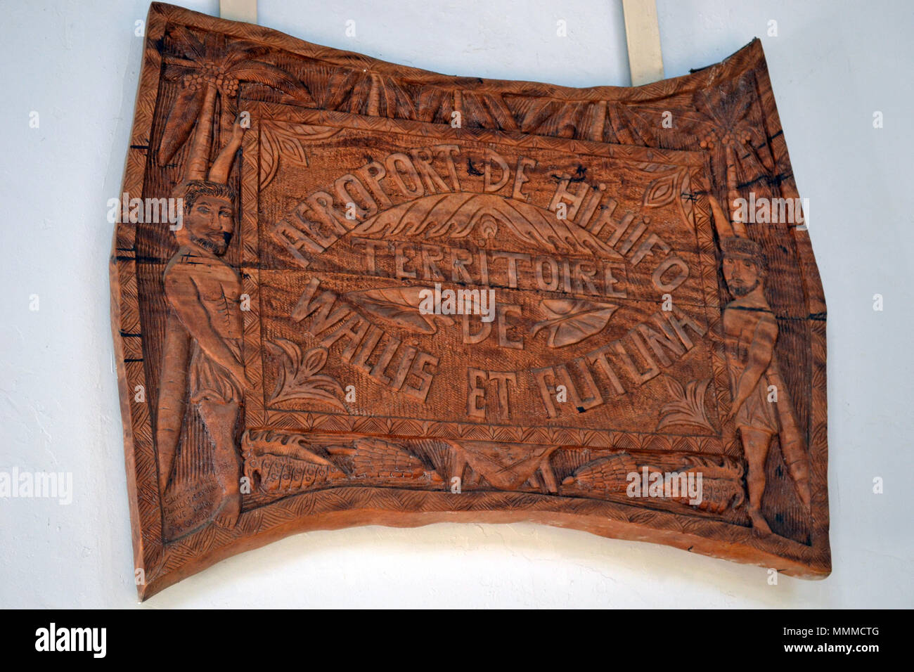 Wooden crafted sign at the lobby of the International Airport of Hihifo ...