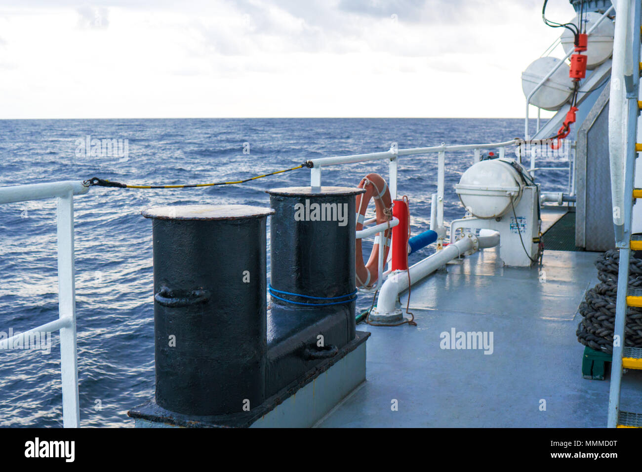 View of ocean from ship or vessel. LSA life saving equipment is on deck ...